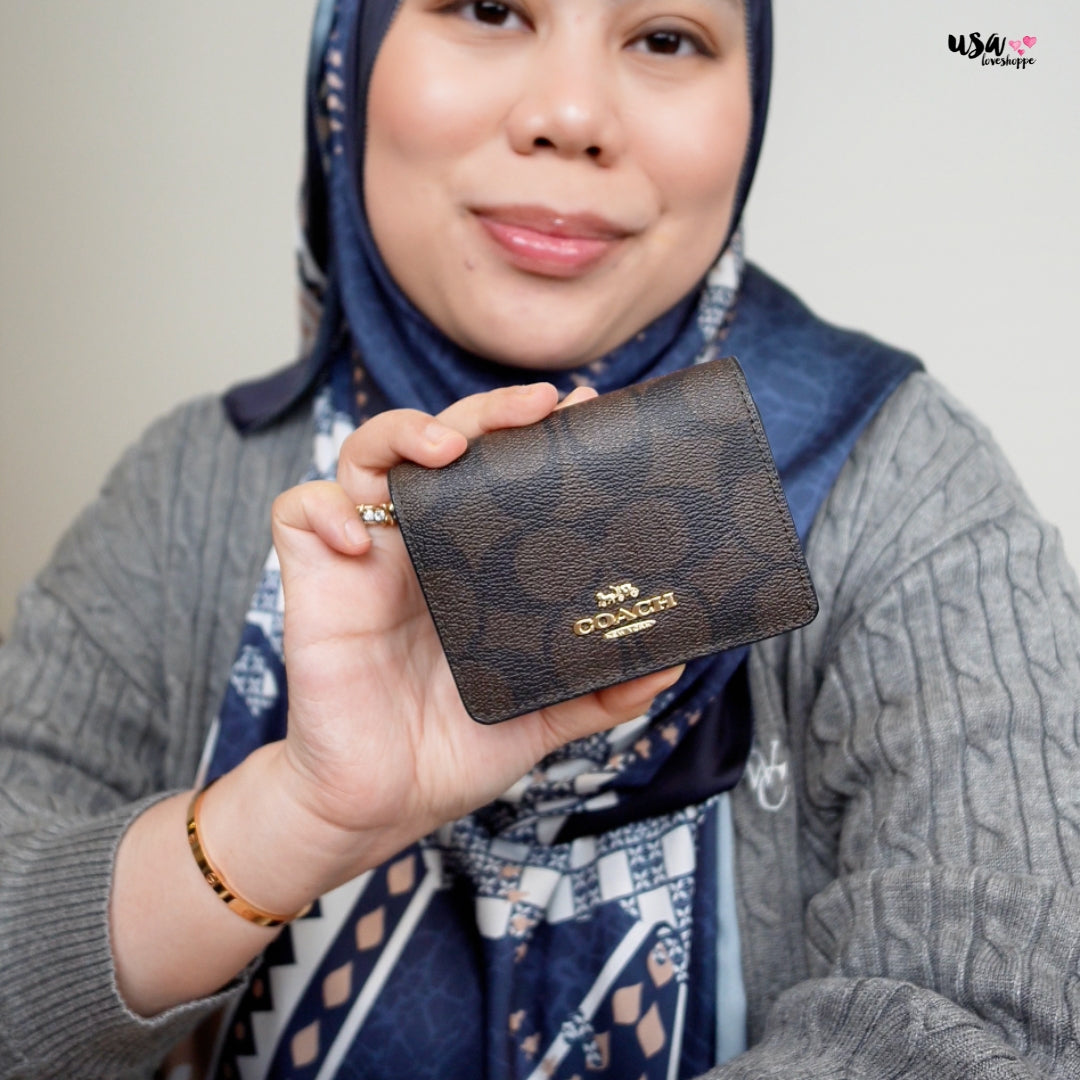 Why the Coach Mini Wallet on a Chain in Signature Canvas Is The Everyd