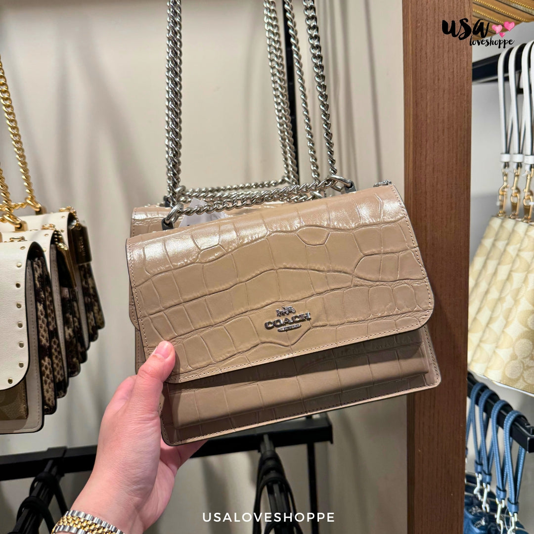 Discover Elegance with the Coach Croc Embossed Leather Klare Crossbody